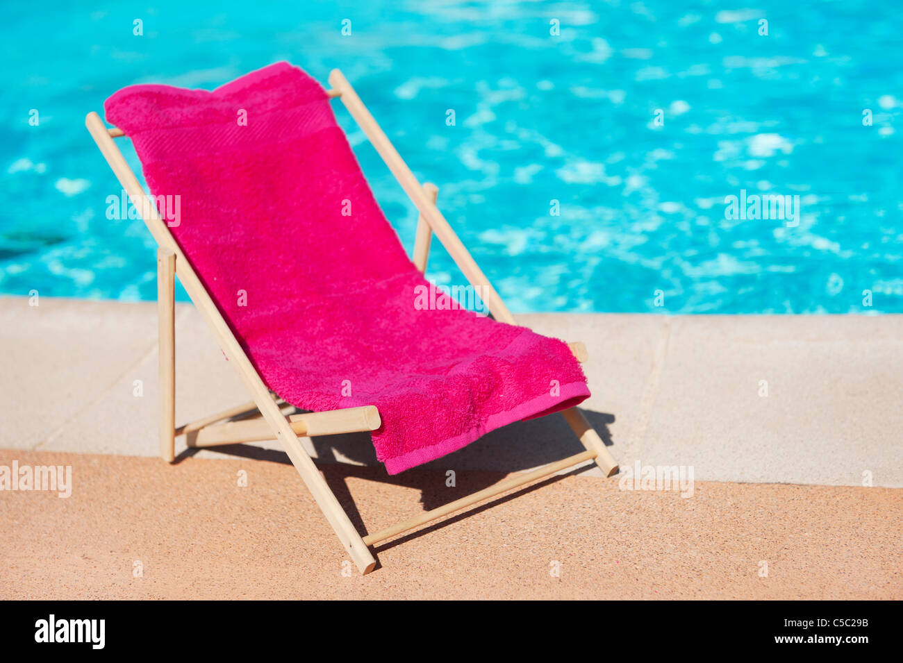 Chair near the swimming pool Stock Photo - Alamy
