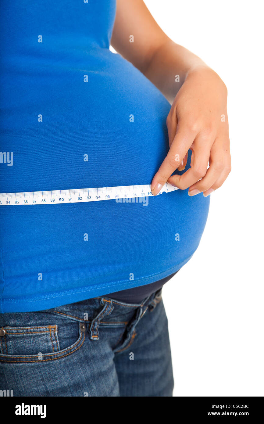Pregnant woman measuring stomach isolated on white Stock Photo - Alamy