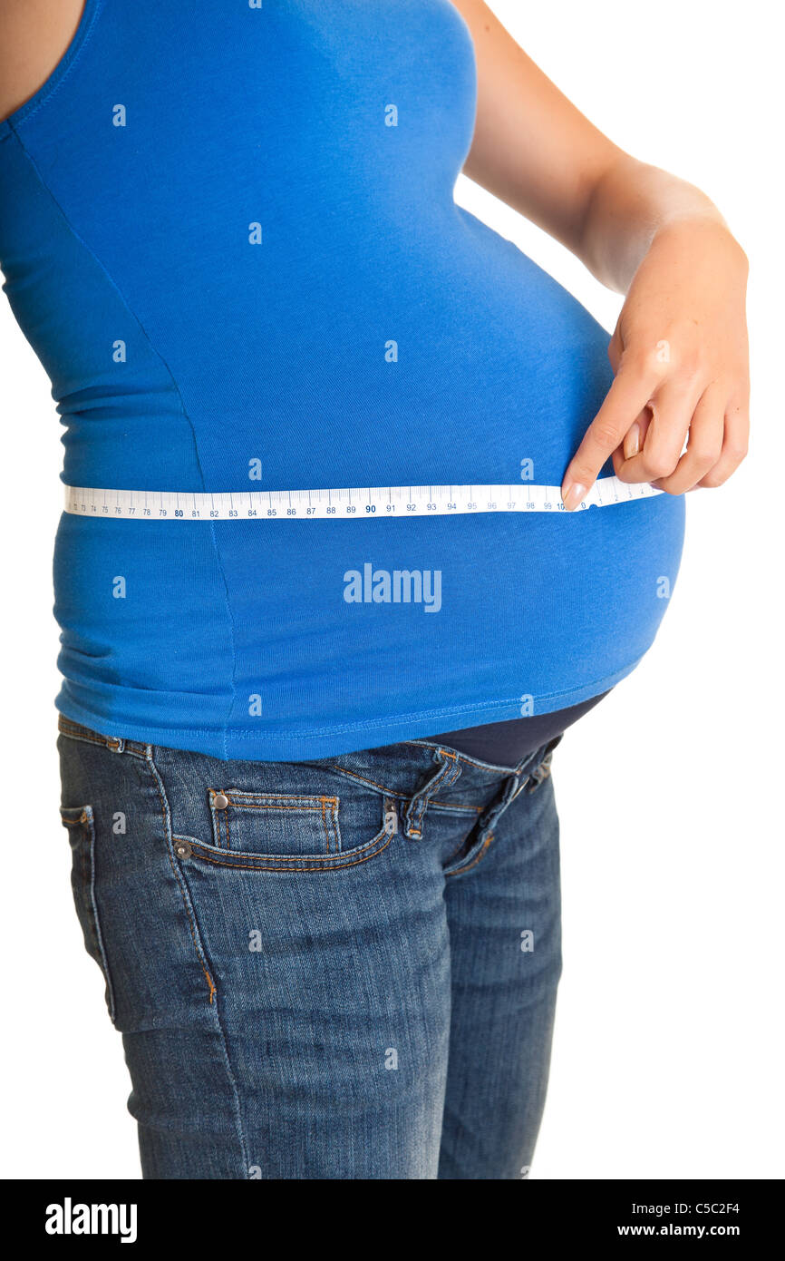 Pregnant woman measuring stomach isolated on white Stock Photo - Alamy
