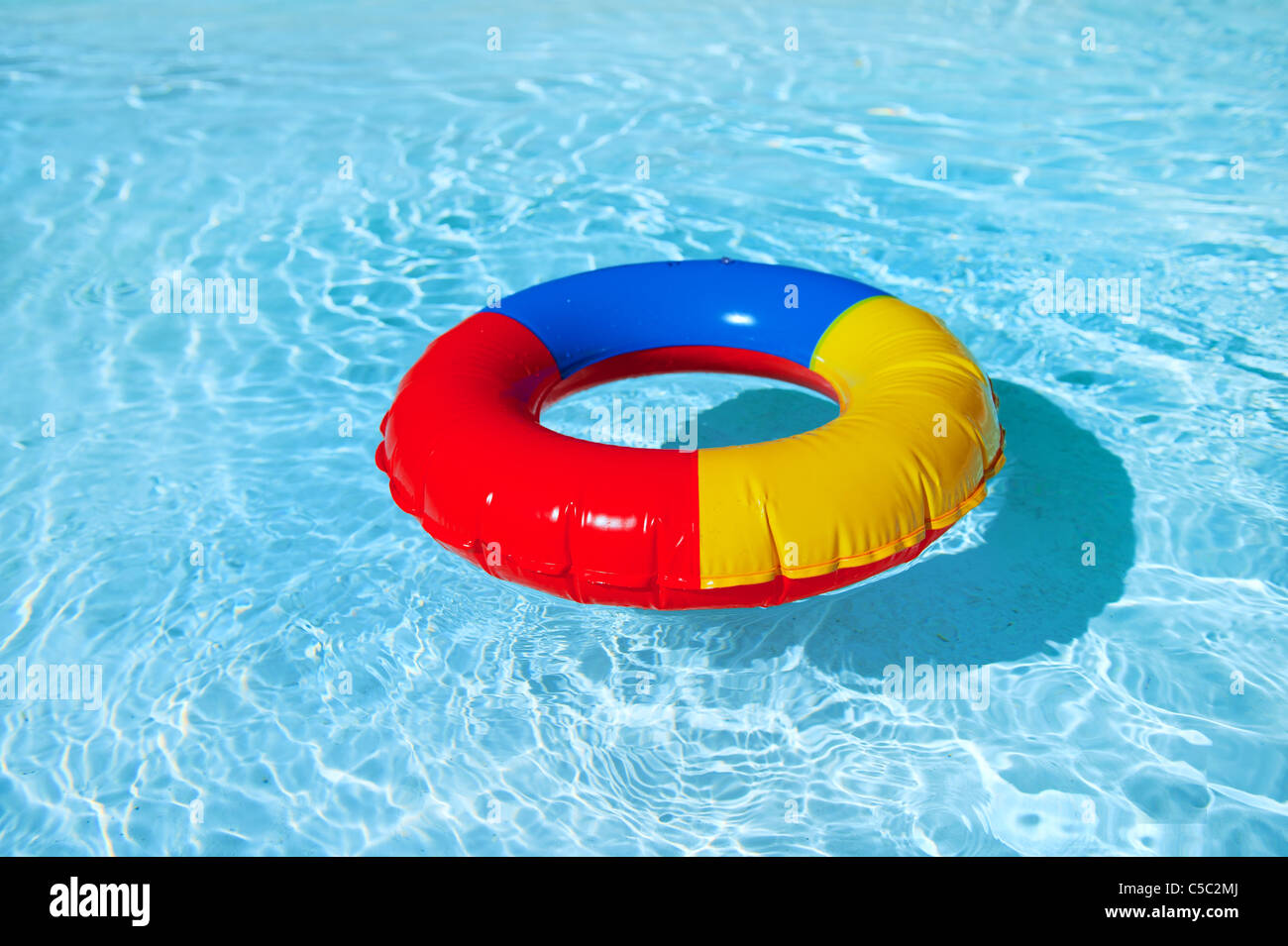 Colorful toy swimming tire at the pool Stock Photo - Alamy