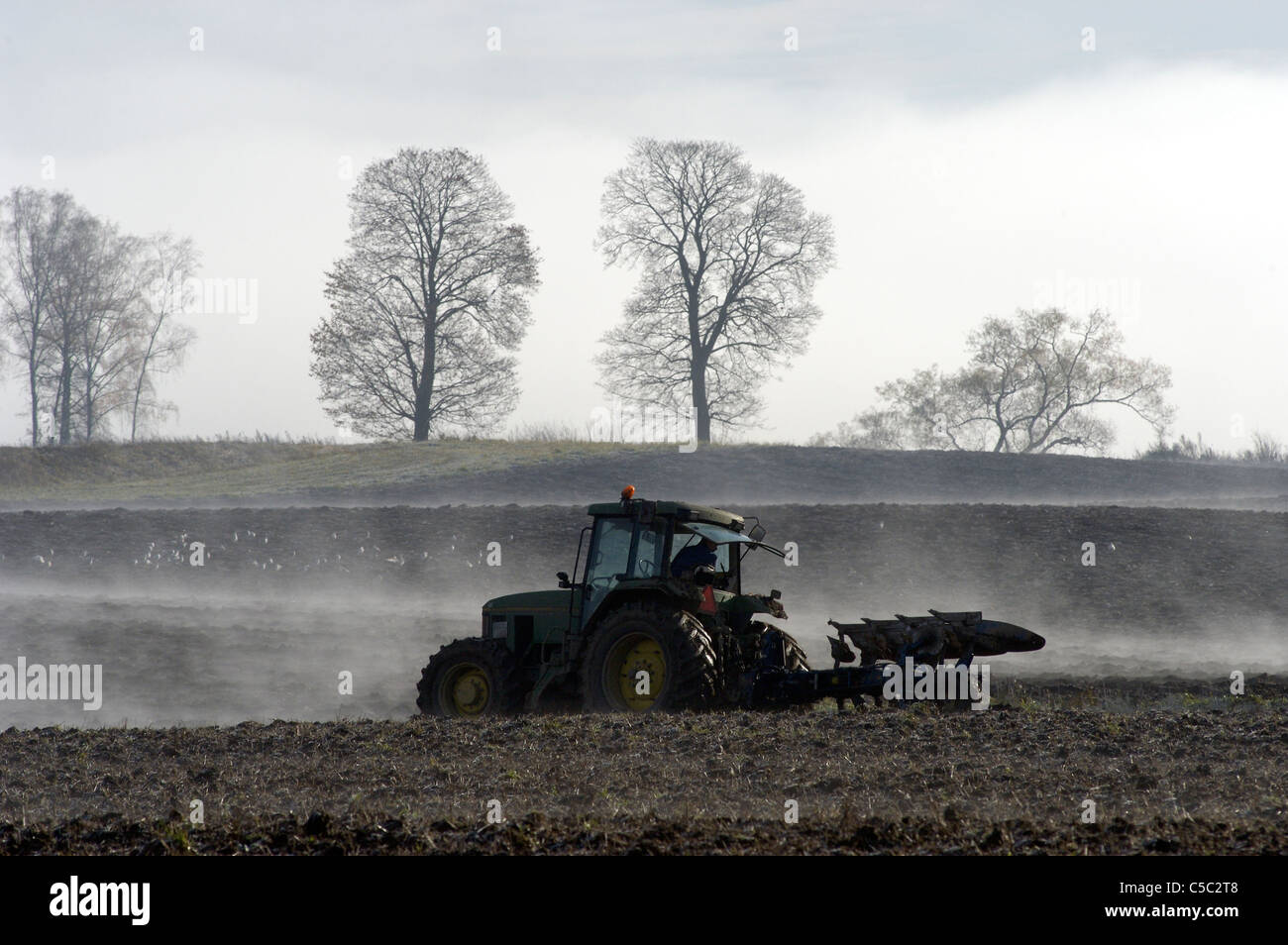 Side view of tractor with plough hi-res stock photography and images ...