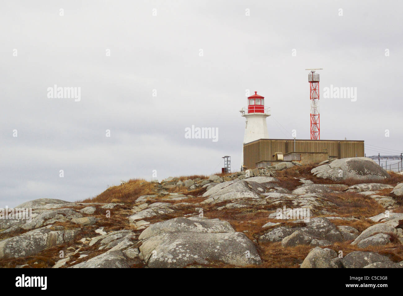 a white Atlantic lighthouse on a granite cliff Stock Photo - Alamy