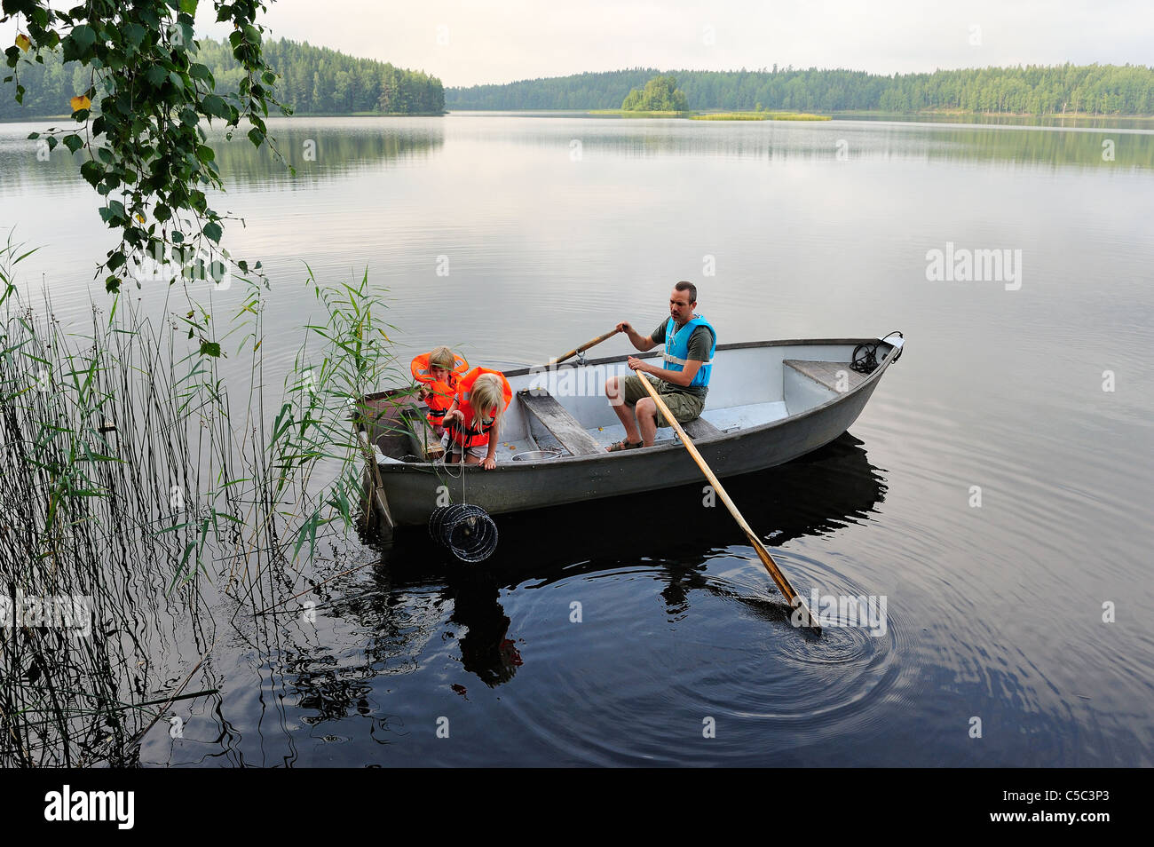 Family boat life jacket hi-res stock photography and images - Alamy