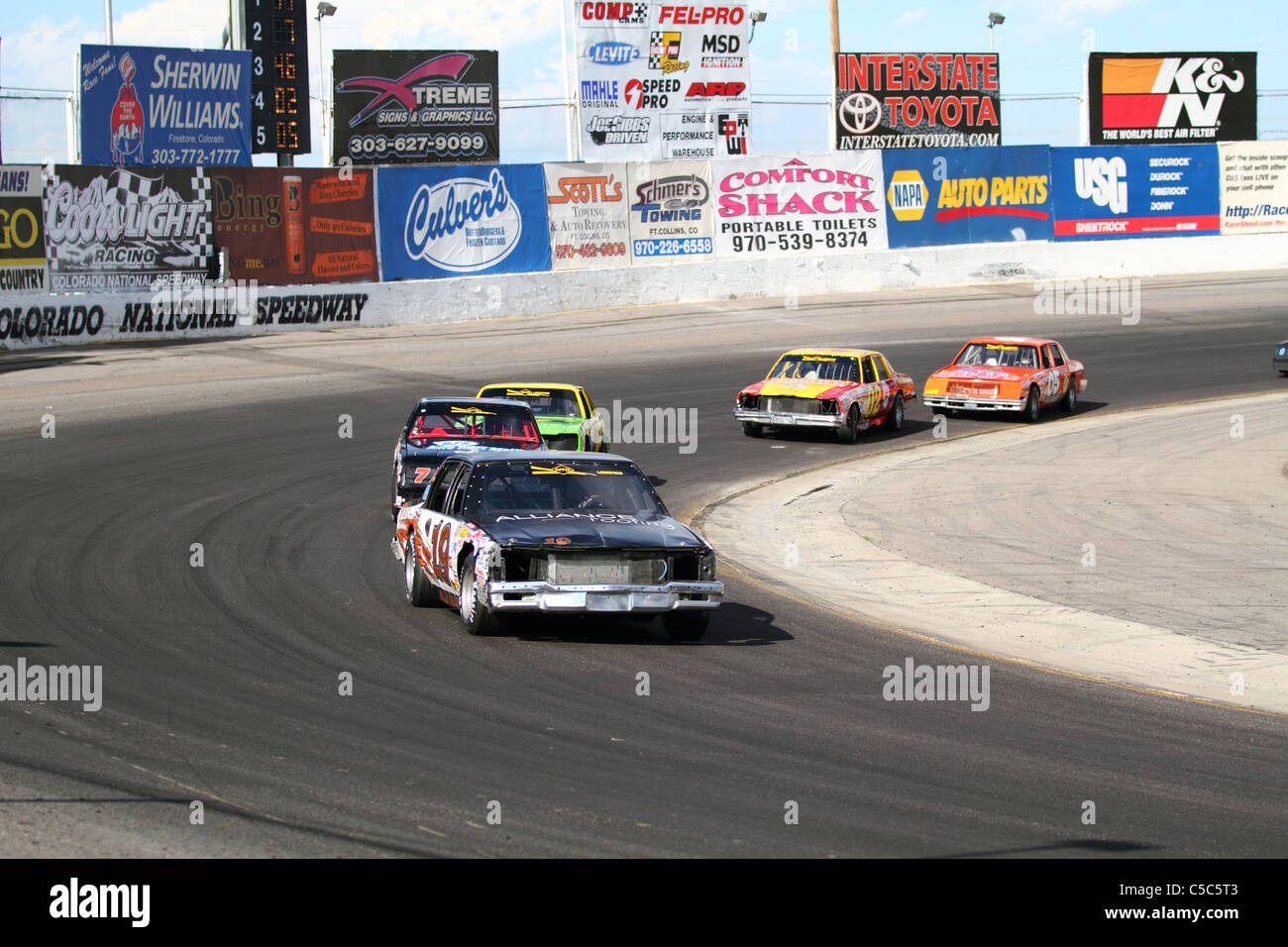 Denver, Colorado - Four cars in the Super Stock racing class round turn ...
