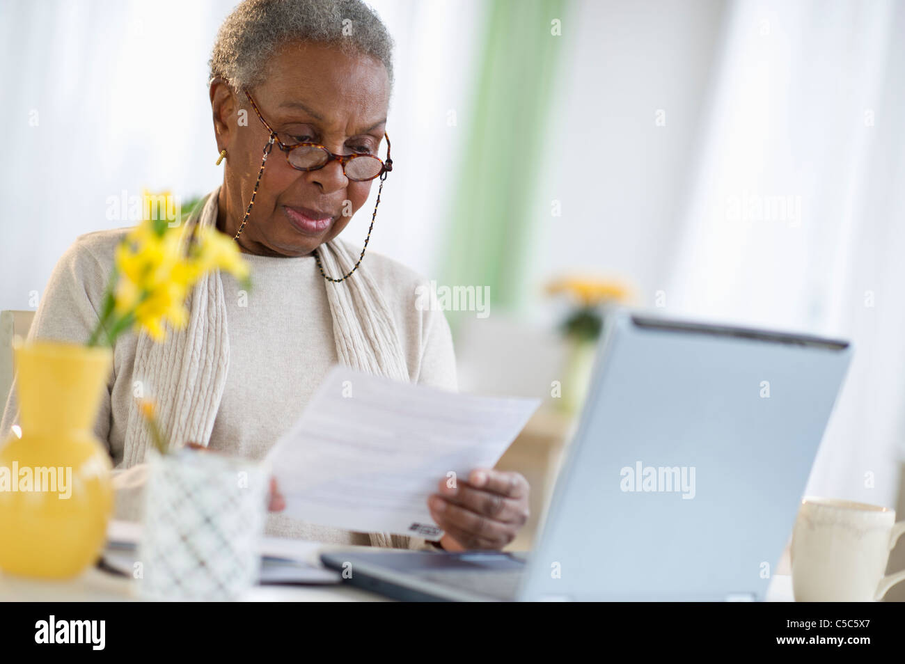 Black woman paying bills online Stock Photo - Alamy