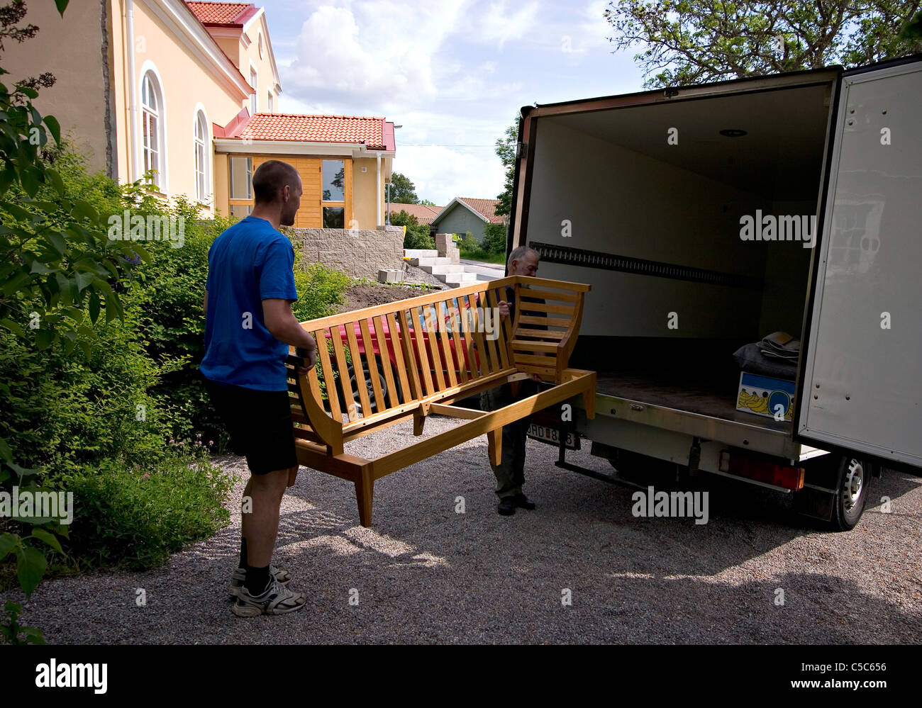 Two men carrying sofa hi-res stock photography and images - Alamy