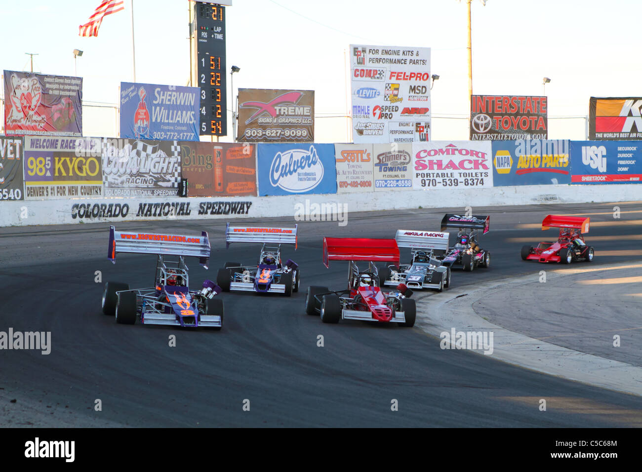 Denver, Colorado - A group of ERA supermodified race cars round turn ...