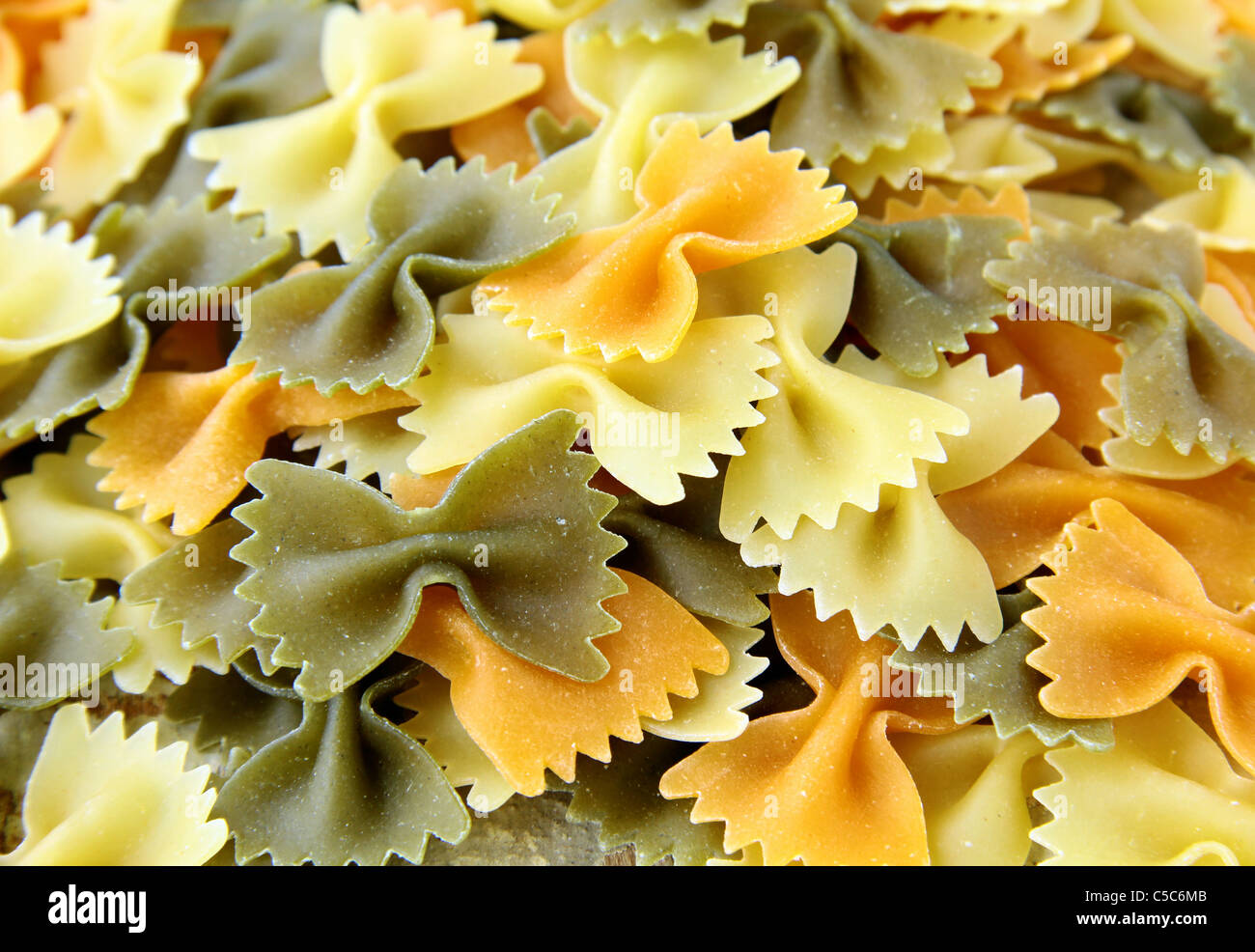 uncooked tricolor pasta Stock Photo - Alamy