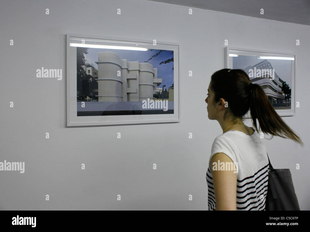 A visitor views photographs depicting Bauhaus buildings displayed ...