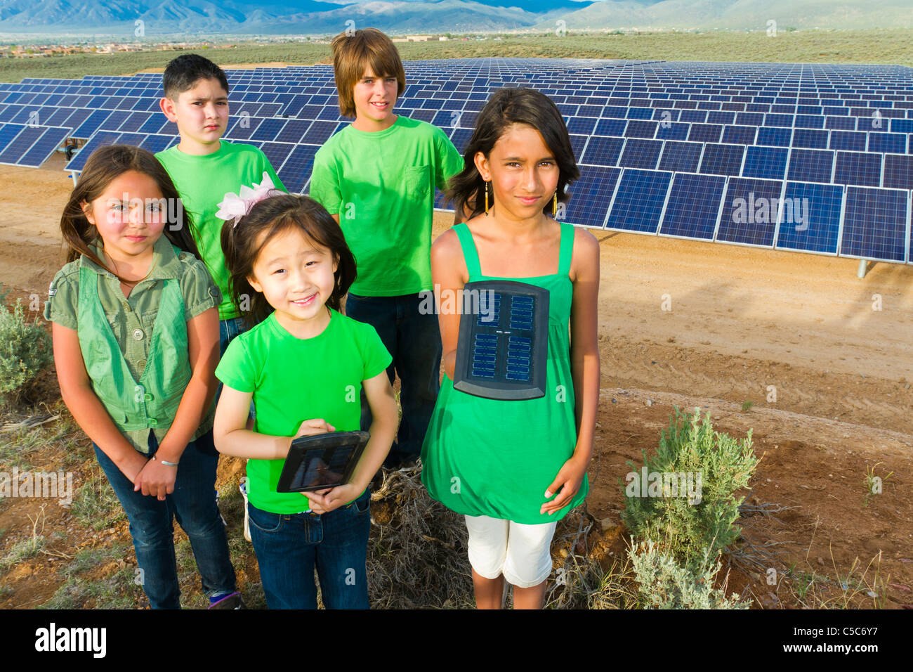 Children standing together in solar panel field Stock Photo - Alamy