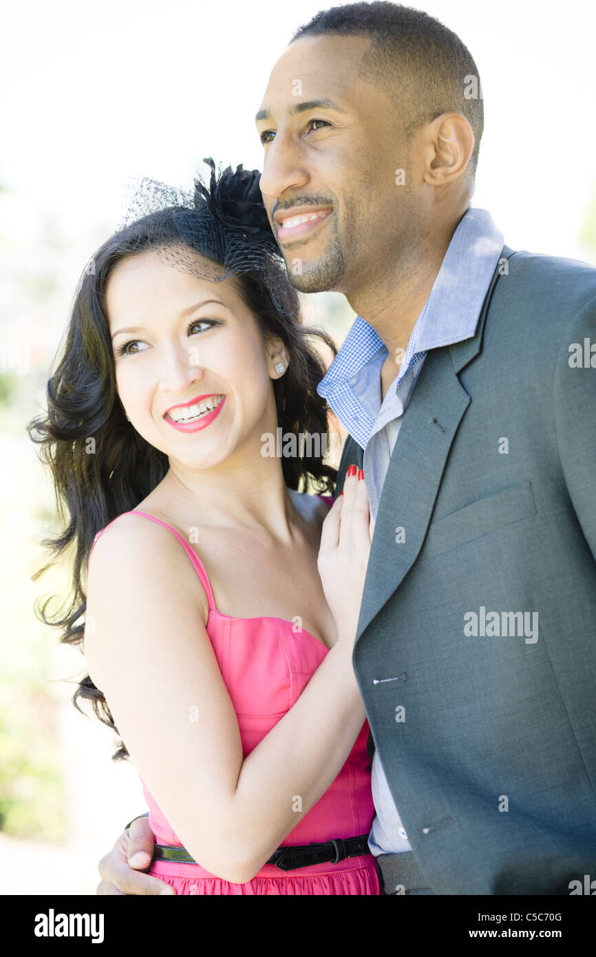 Glamorous couple standing together outdoors Stock Photo - Alamy