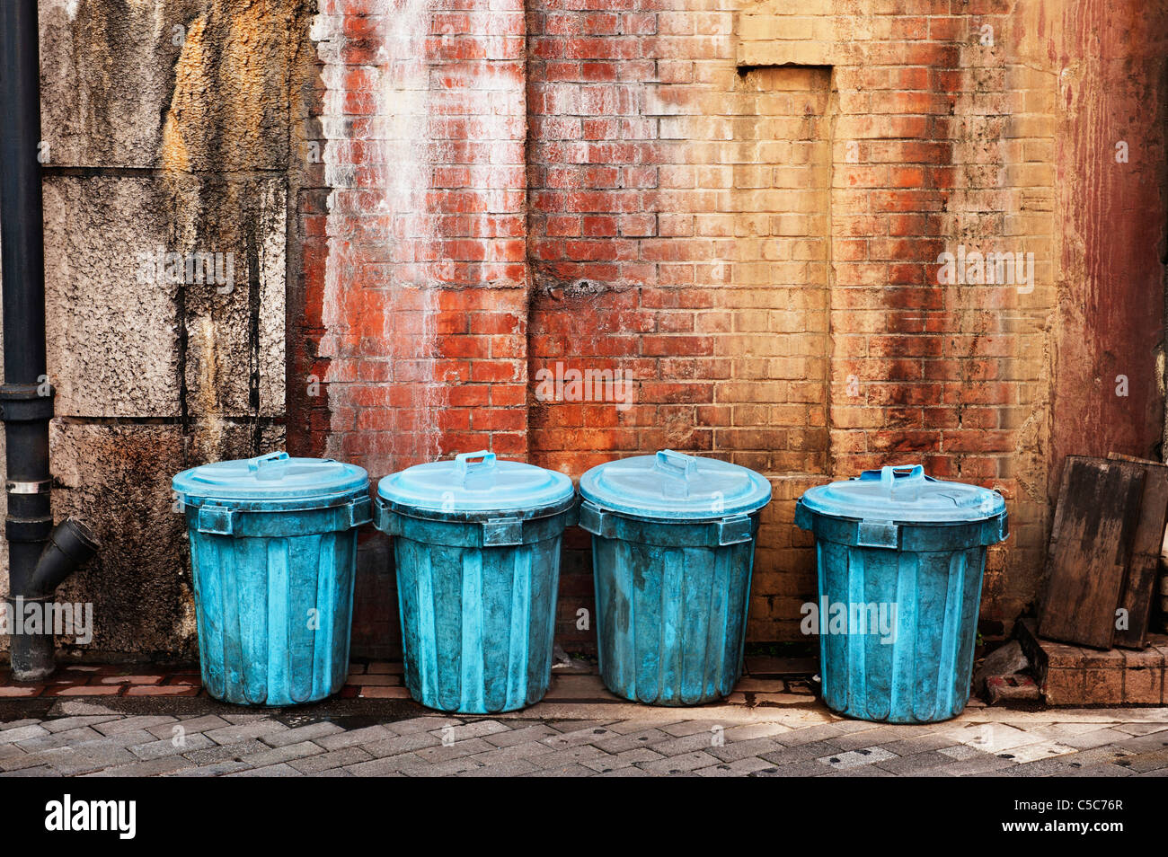 Trash cans in an alley hi-res stock photography and images - Alamy