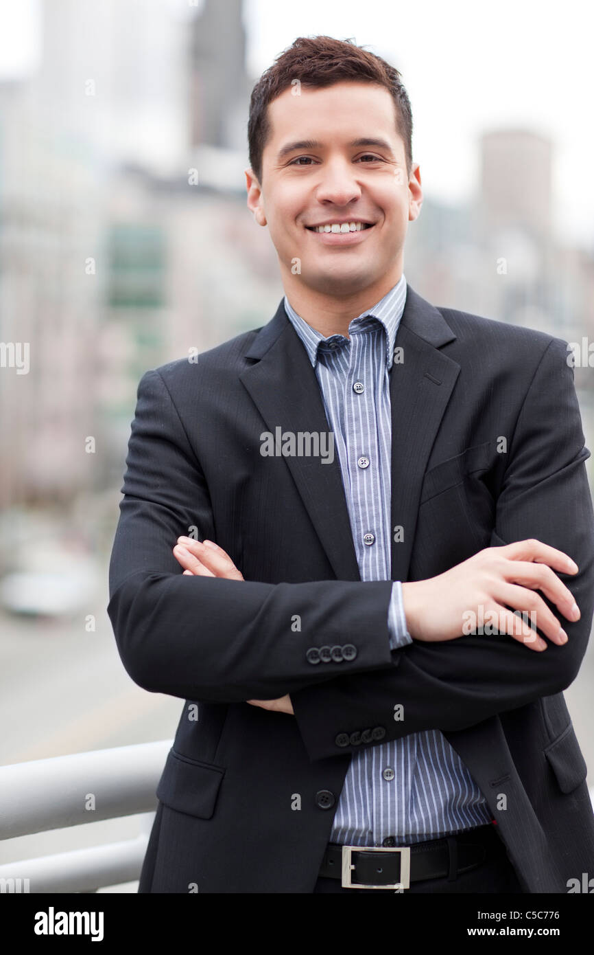 Mixed race businessman standing outdoors Stock Photo - Alamy