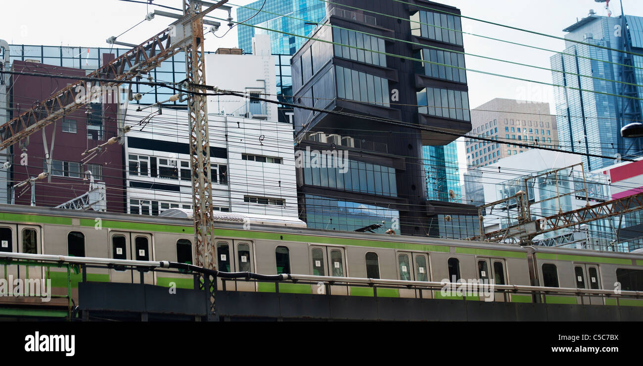 A Public Transportation Train Traveling Past Buildings In An Urban Area ...