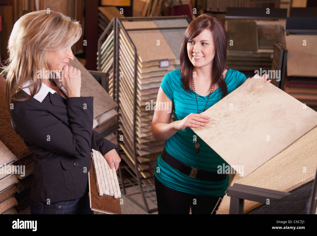 Design Consultant Assisting A Customer In A Retail Flooring Store ...
