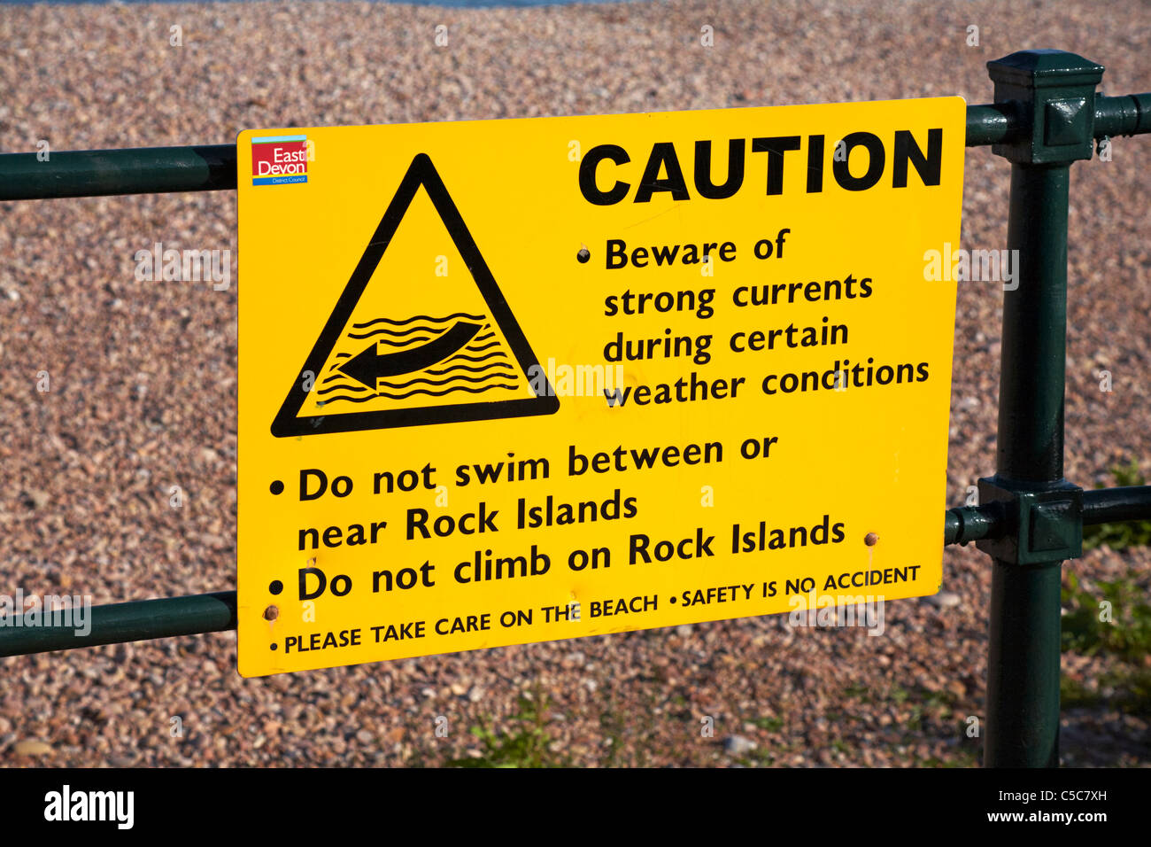 Caution notice on beach Stock Photo - Alamy
