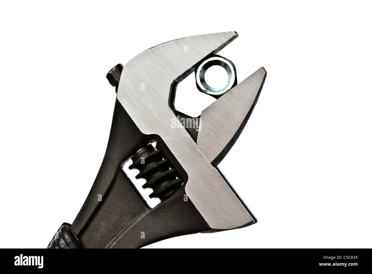 Adjustable wrench and nut isolated on white background Stock Photo - Alamy