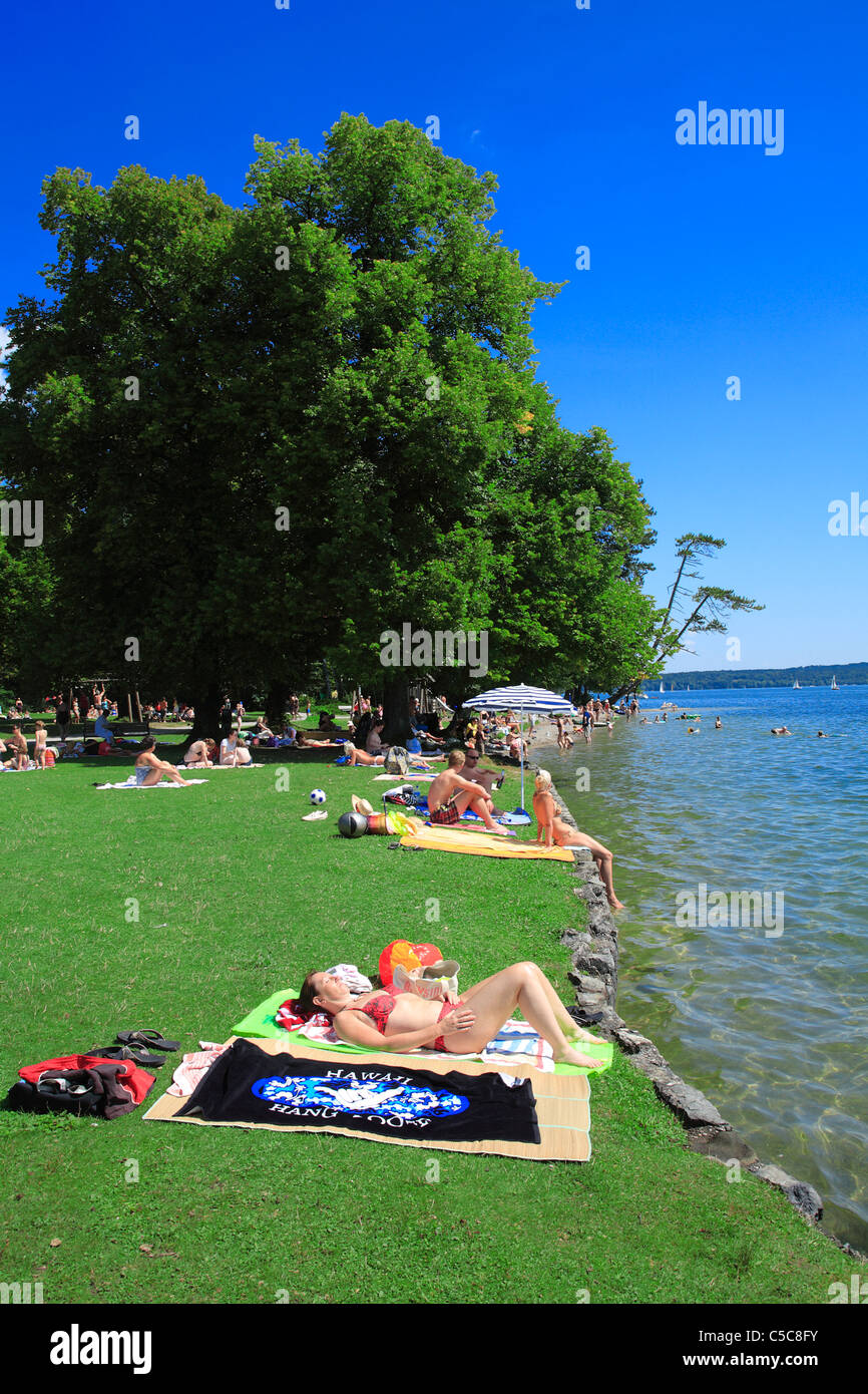 sunbathing people at lake starnberg city of tutzing bavaria germany ...