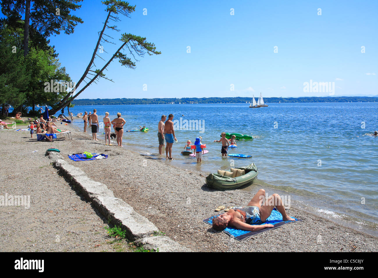 sunbathing people at lake starnberg city of tutzing bavaria germany ...