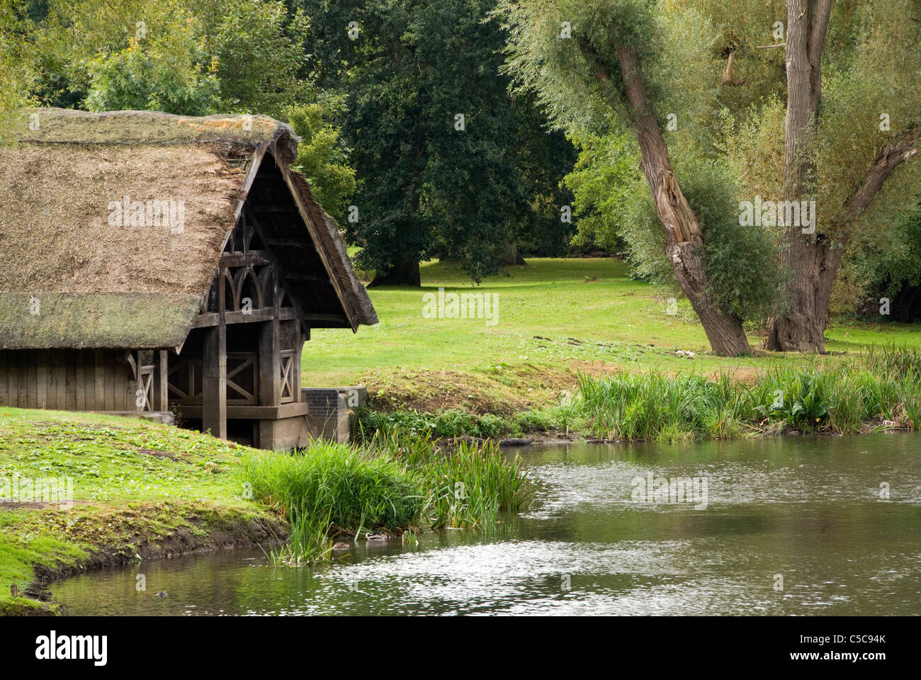 Old thatched boathouse on the River Avon, Warwick Castle, Warwick ...