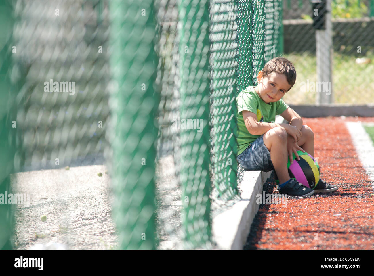 a boy having rest after football game Stock Photo - Alamy