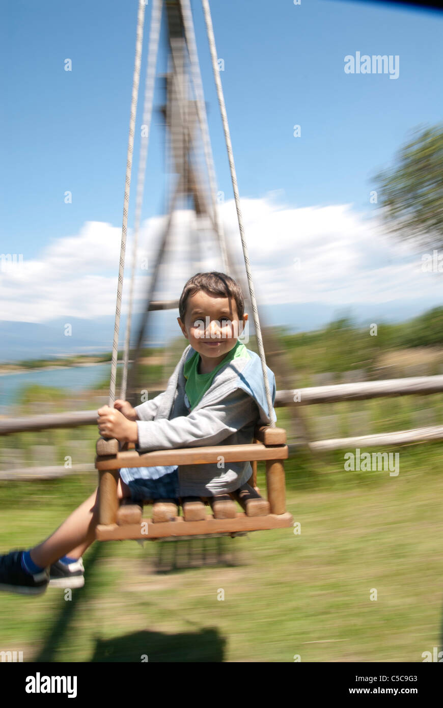 a boy on a swing Stock Photo - Alamy