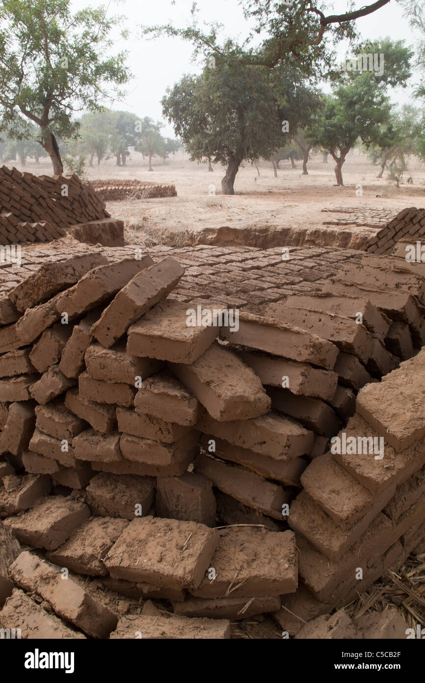 Mud bricks drying in the sun in Mali West Africa Stock Photo - Alamy