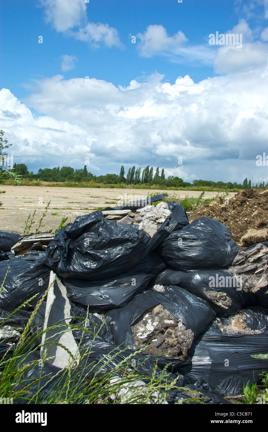 Rubbish dumped in a field Suffolk, England Stock Photo - Alamy