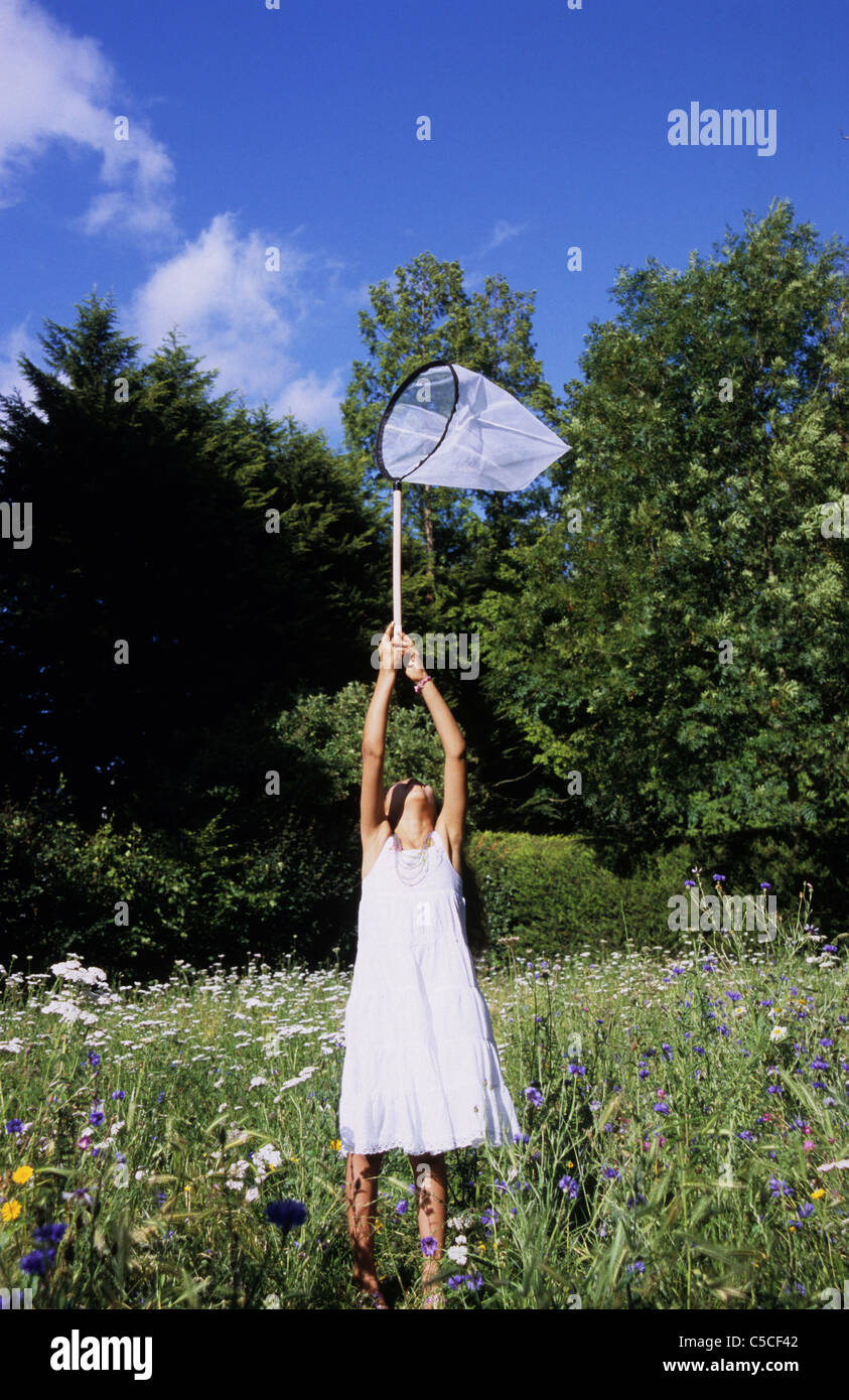 Girl catching butterfly hi-res stock photography and images - Alamy