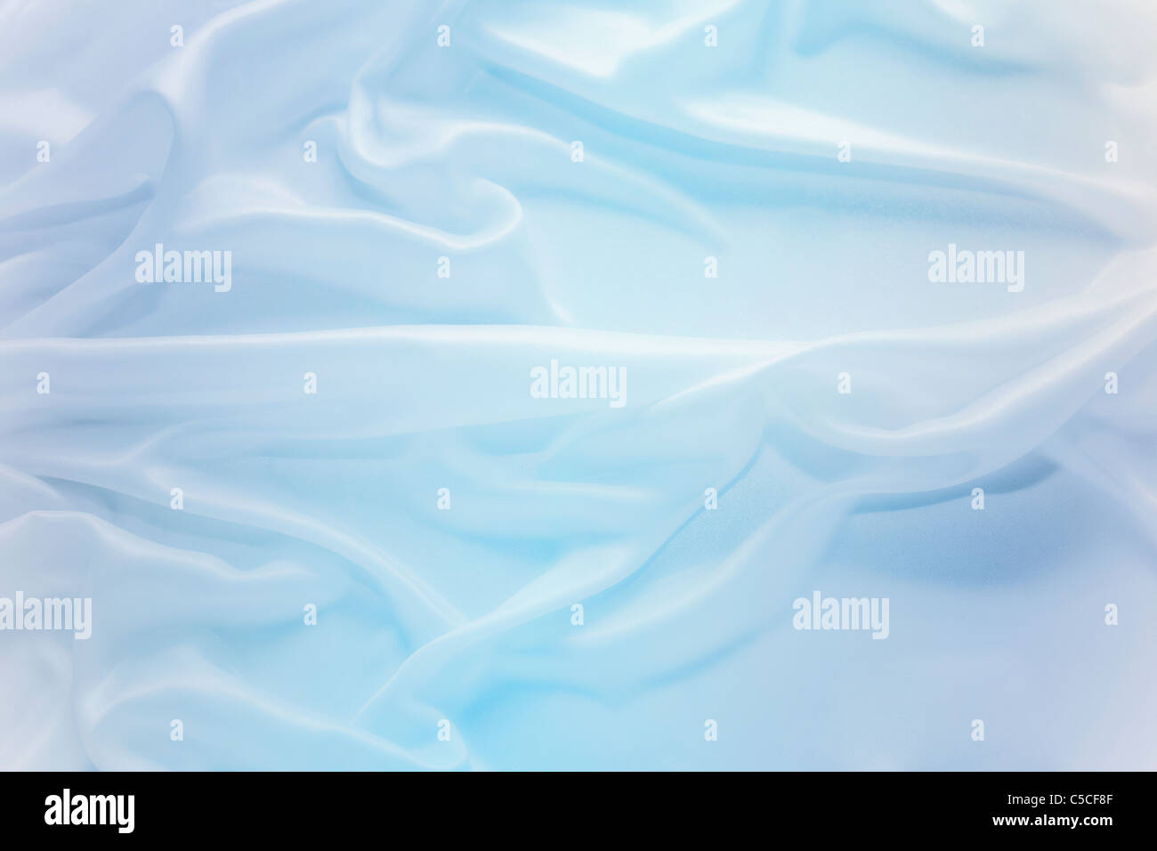 delicate waves of blue satin silk Stock Photo - Alamy