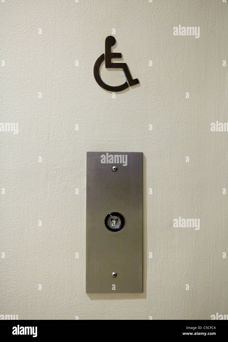 A wheelchair access sign above elevator call button - USA Stock Photo ...