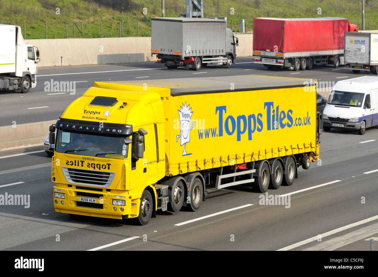 Front view yellow hgv store delivery lorry truck Topps Tiles brand web ...