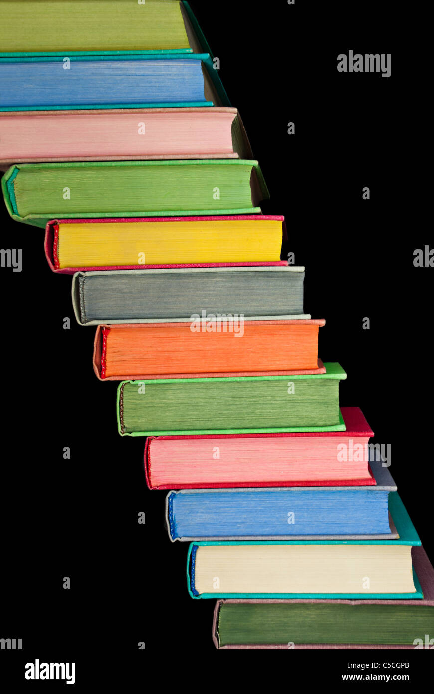 Stack of colored hard covered used books Stock Photo - Alamy