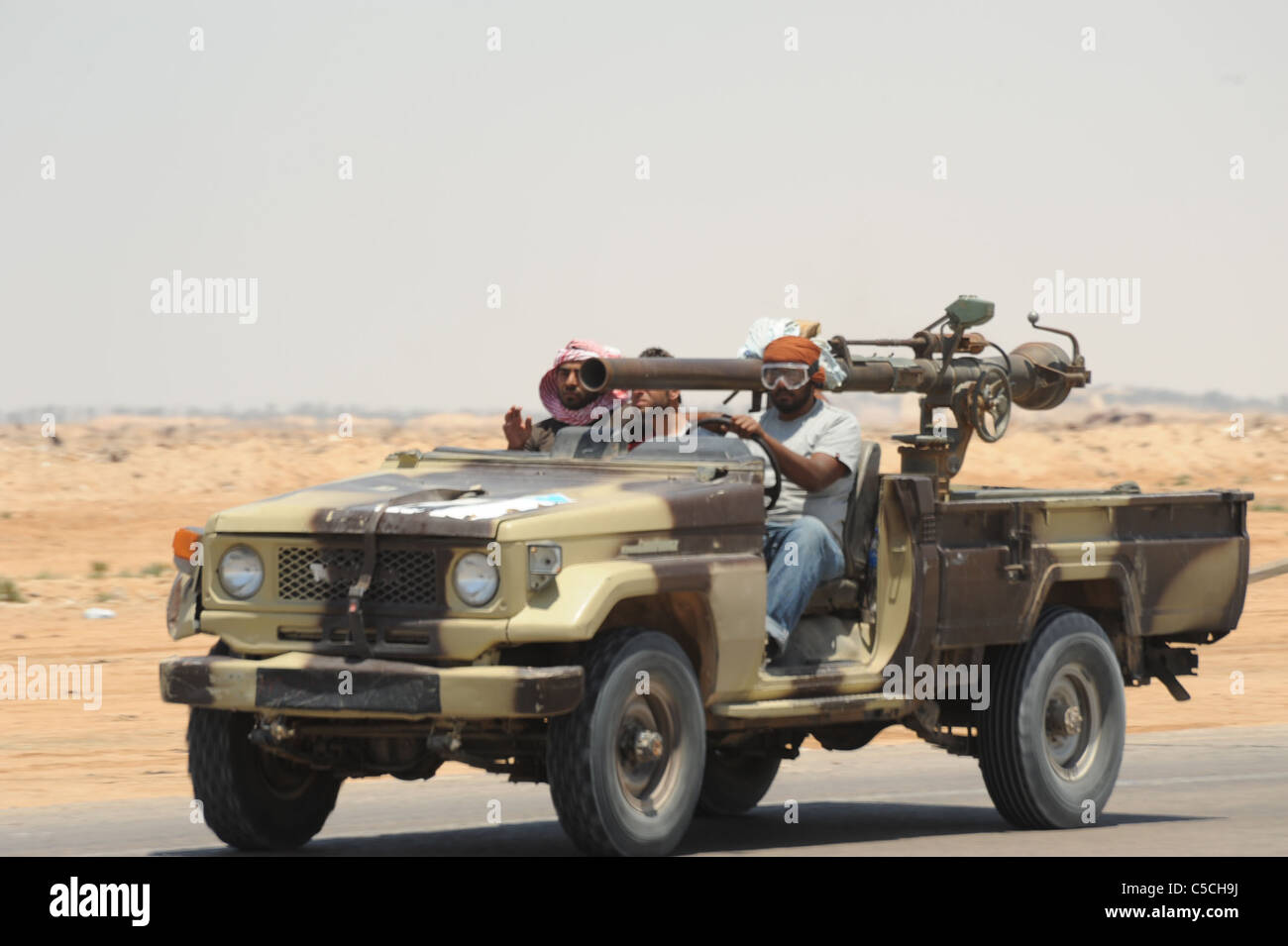 a pick up truck with a 120mm ant tack gun on the back. driving to the ...