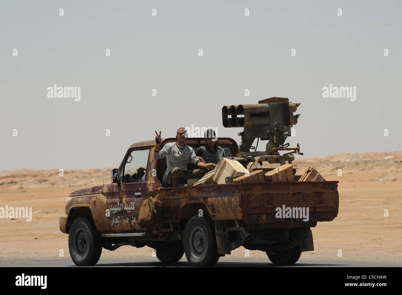 A six barrel rocket launcher on the beck of a pick up truck on the way ...