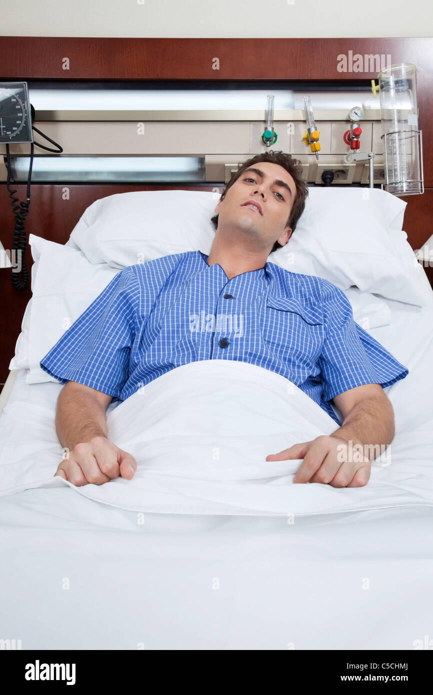 An severe male patient at hospital bed Stock Photo - Alamy