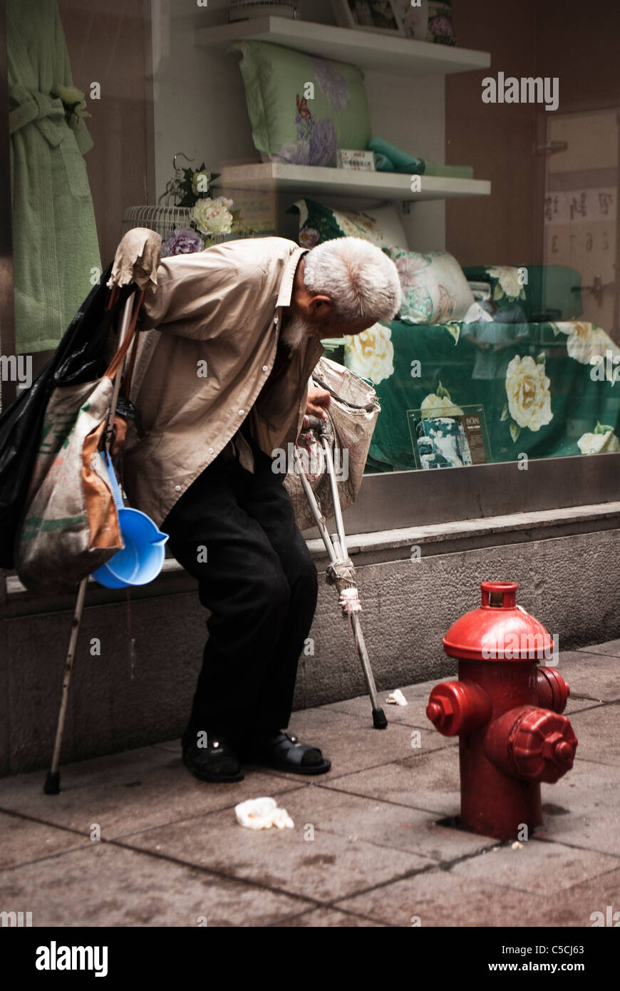 old homeless man on crutches,shanghai,china Stock Photo - Alamy