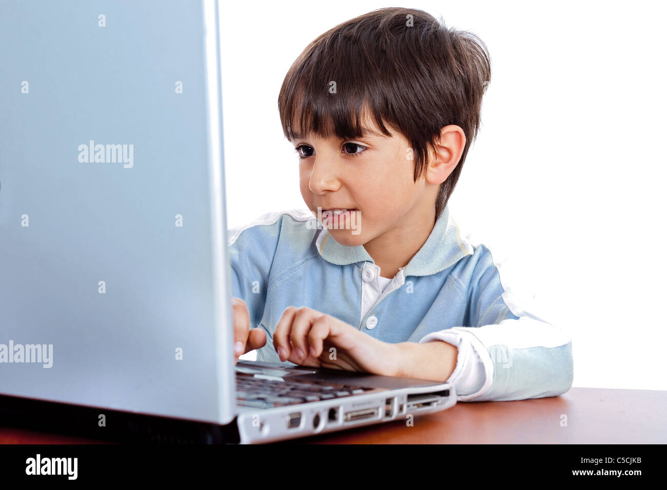 Cute caucasian kid working in laptop on isolated white background Stock ...