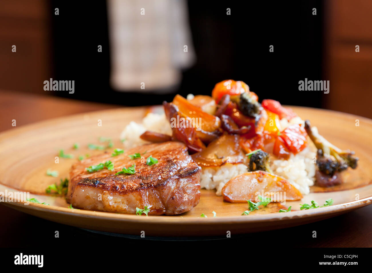 Pork, rice, and roasted vegetables Stock Photo - Alamy