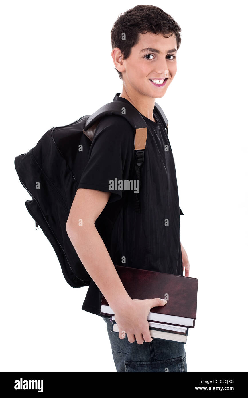 Side pose of handsome teenager boy student with books in hand on ...