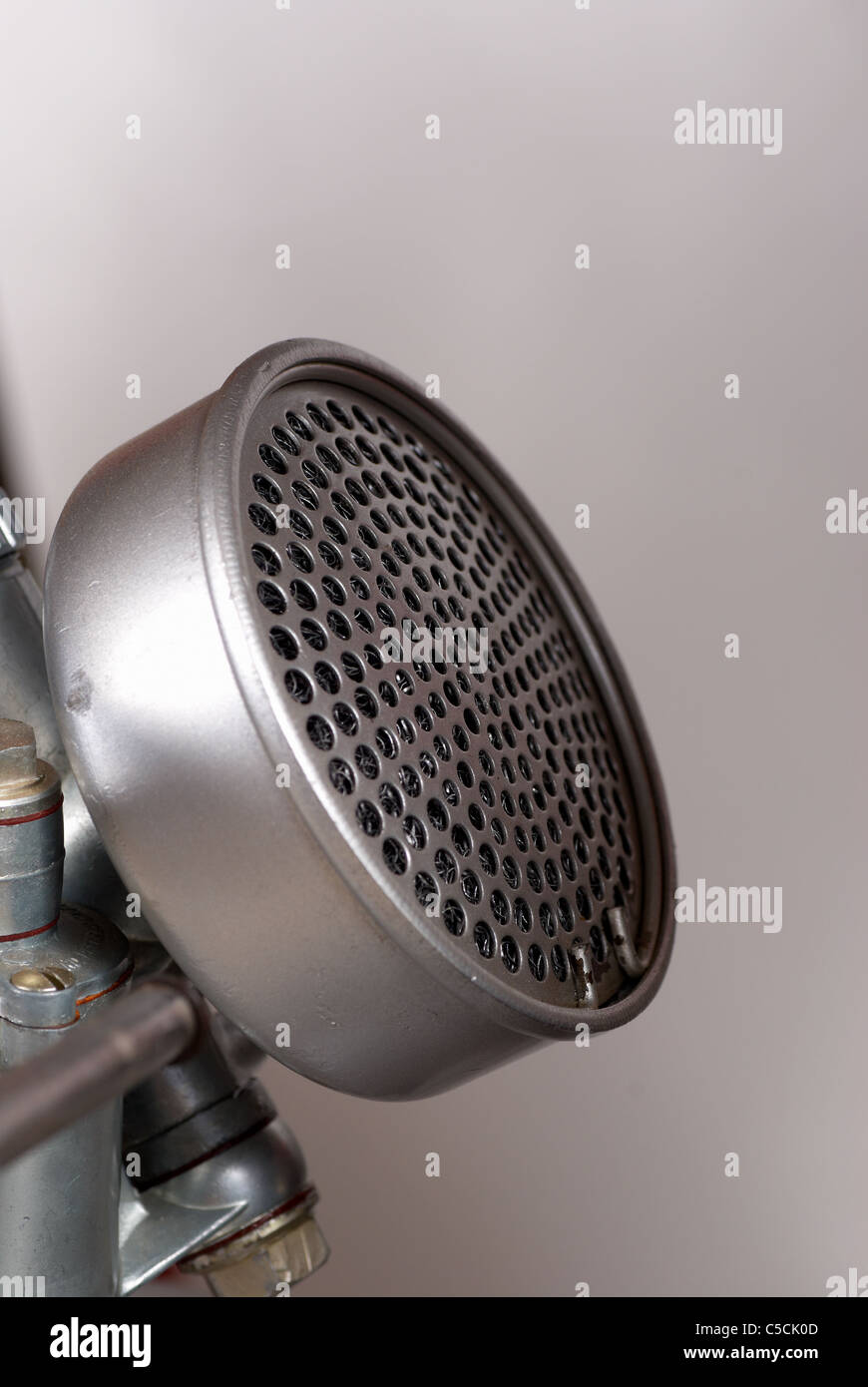 Air intake with filter on a vintage motorbike engine Stock Photo - Alamy