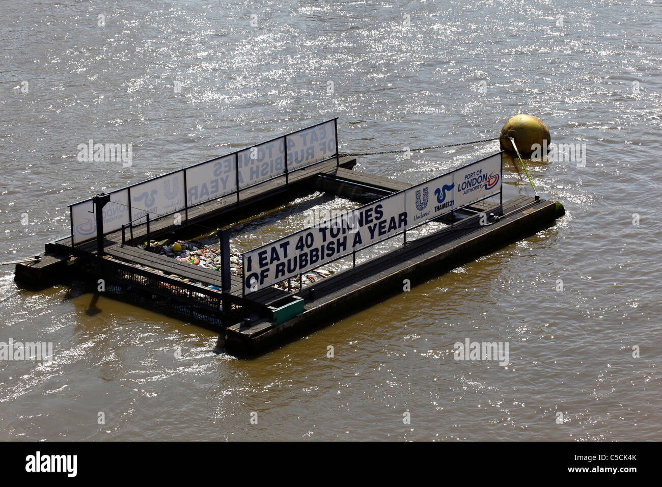 Rubbish collecting barge floating on River Thames near Blackfriars ...