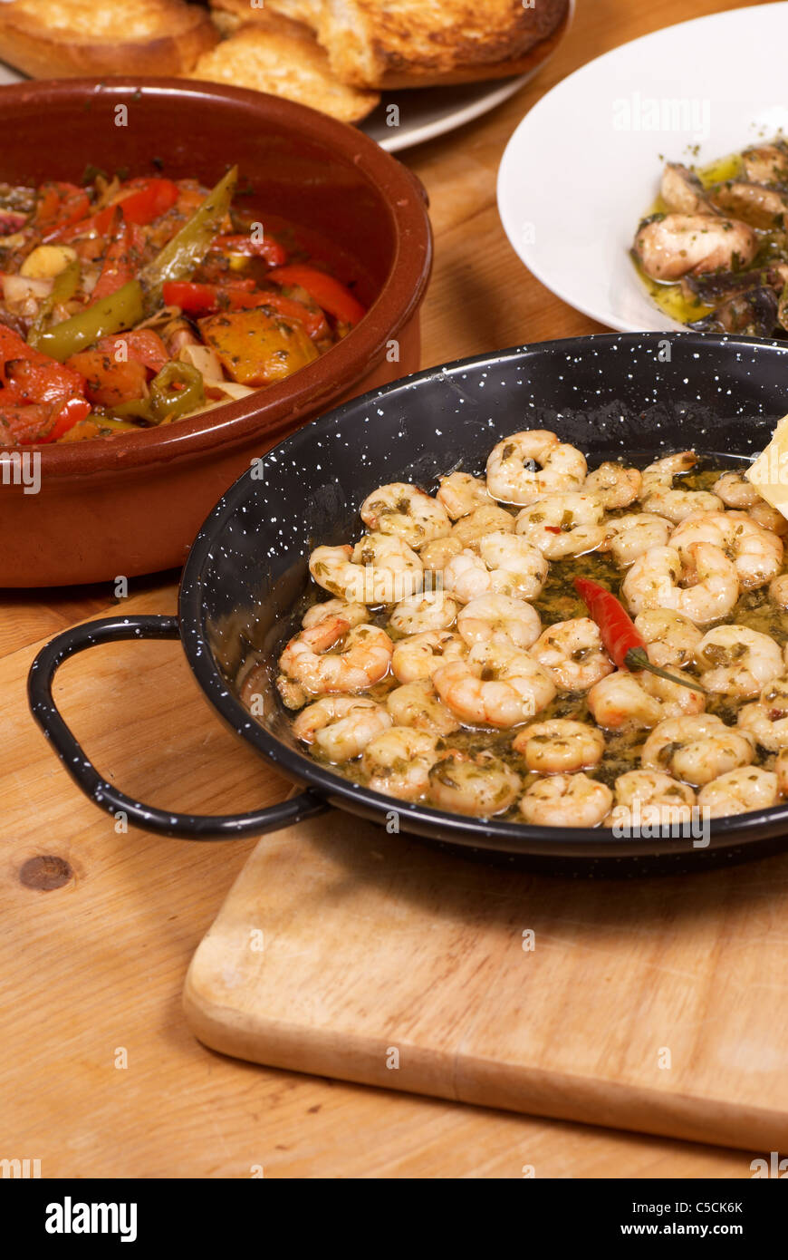 Assortment of several Spanish tapas on a wooden table Stock Photo - Alamy