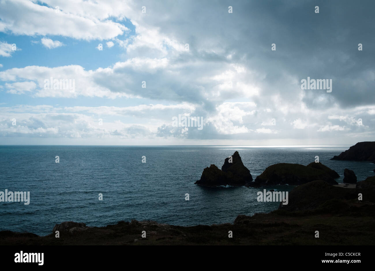 A seascape with blue sky and steely grey storm clouds brooding. UK ...