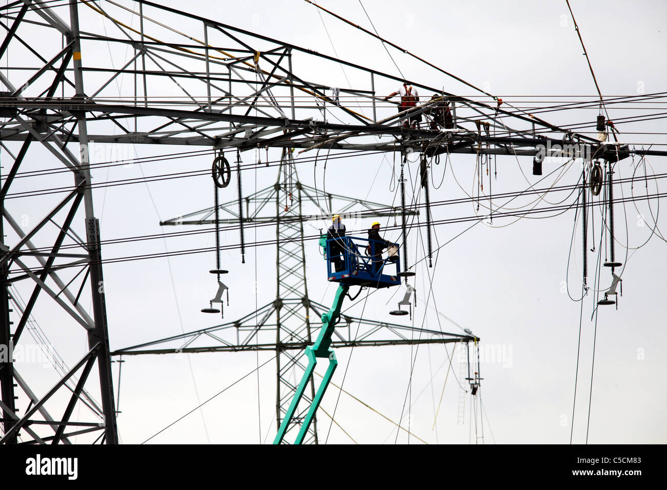 Construction of new High-voltage power lines. New electricity pylons ...