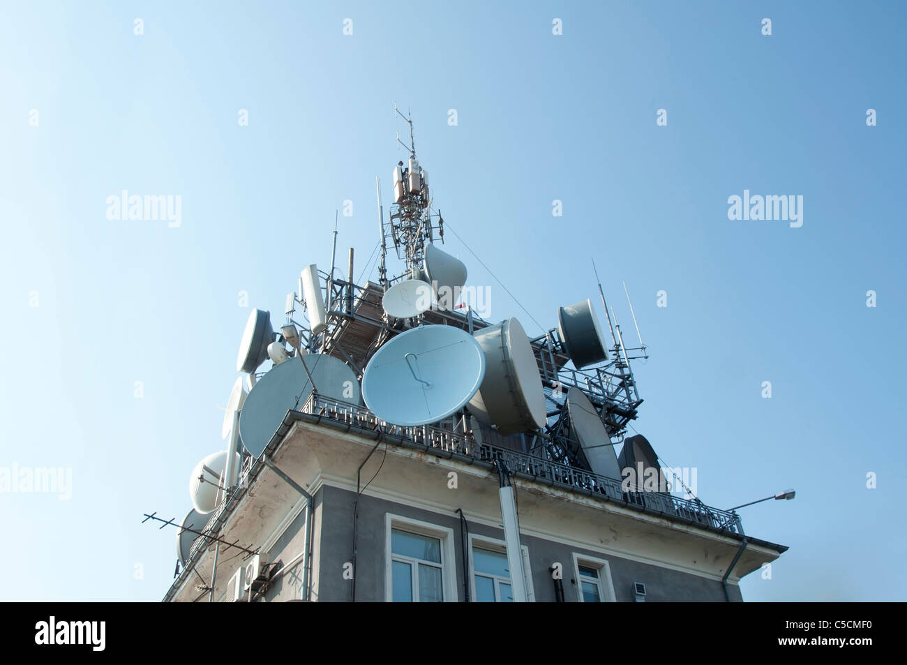 Transmitters, antennas and repeaters on building Stock Photo - Alamy