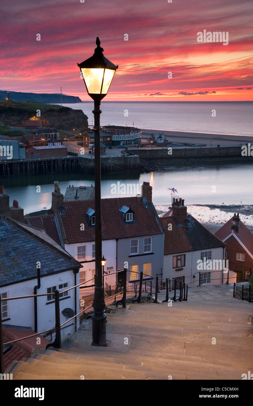 View to Whitby Harbour at sunset from the 199 steps leading from The ...