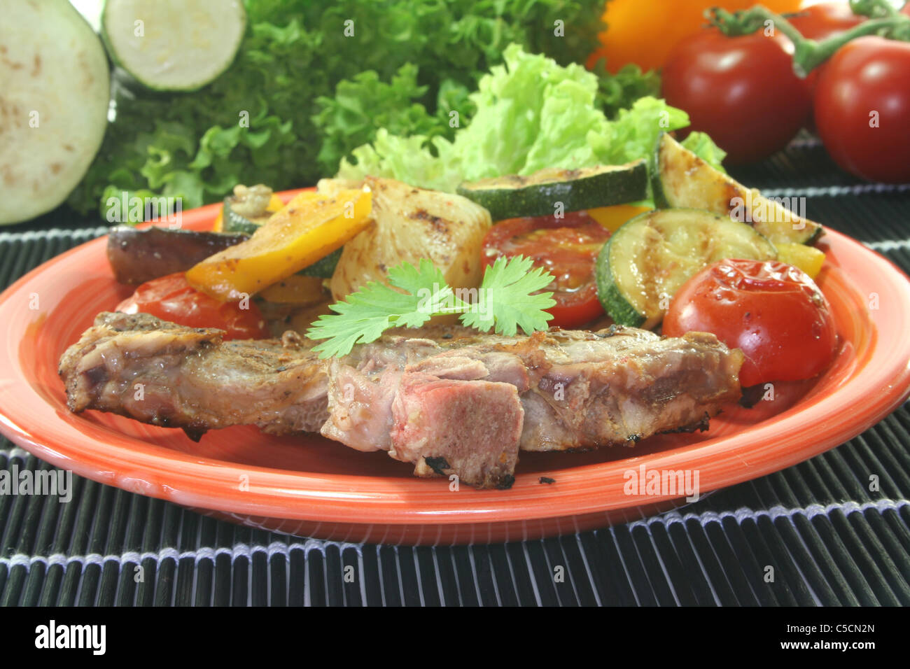 Grilled pork chop with grilled Mediterranean vegetables Stock Photo - Alamy