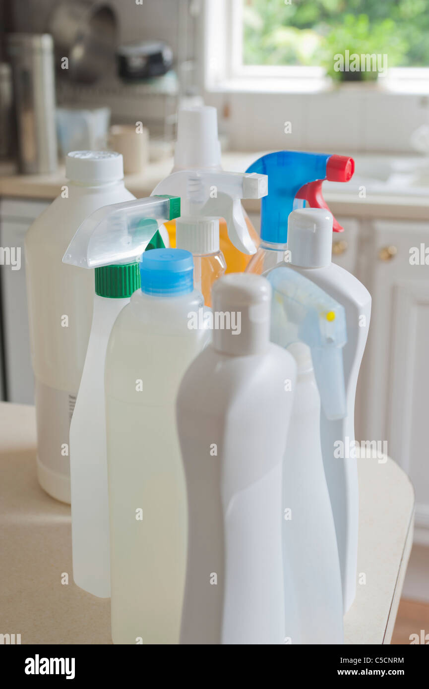Collection of bottles containing different chemical cleaners in a ...
