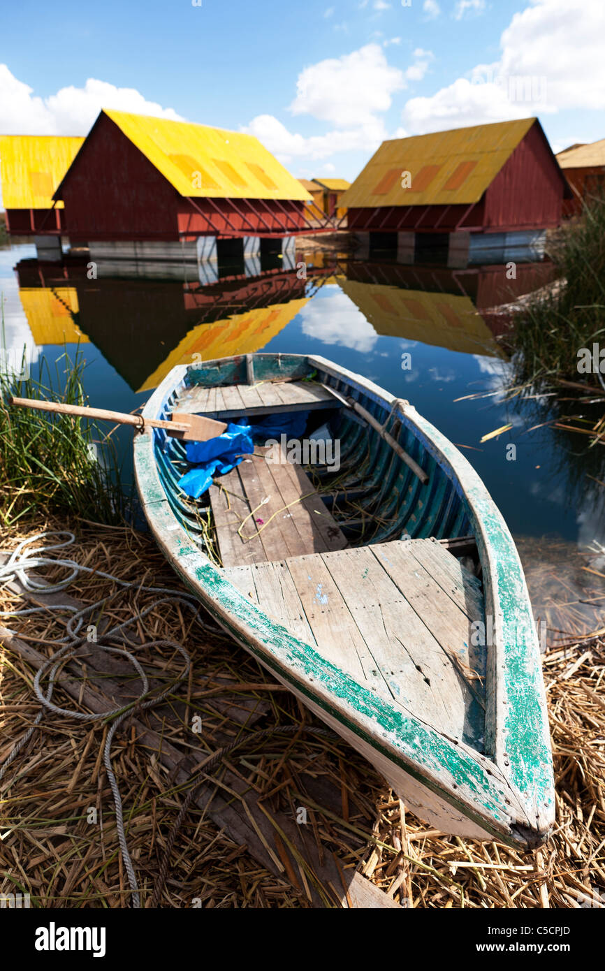 Local transport on the floating islands of Uros with new houses in the ...